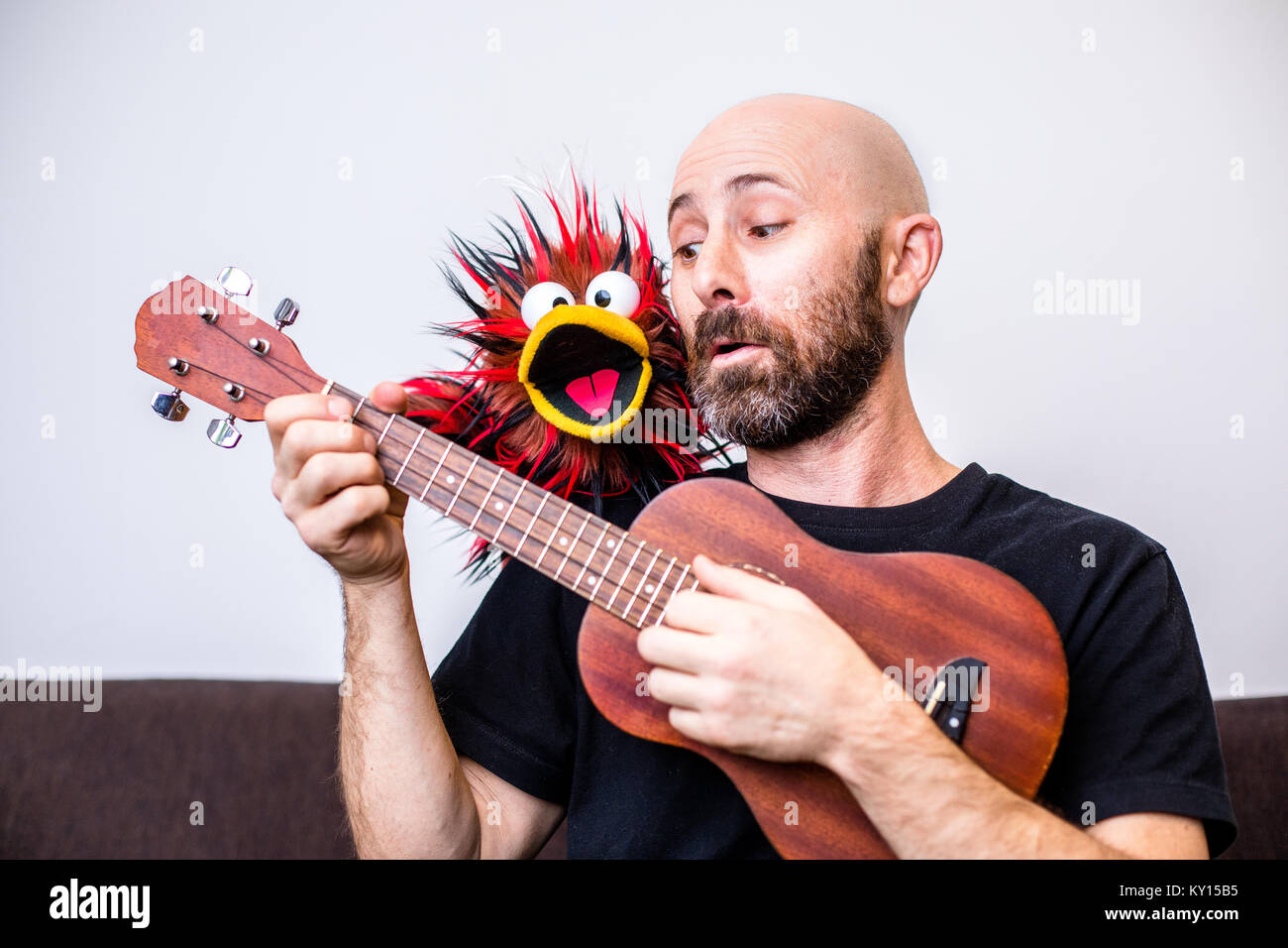 PORTRAIT OF SCHULTZ THE PUPPET AND BALD CAUCASIAN MAN WITH BEARD ...