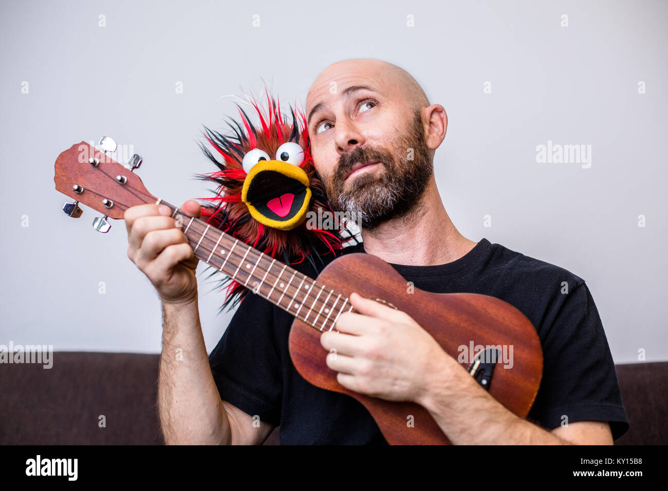 PORTRAIT OF SCHULTZ THE PUPPET AND BALD CAUCASIAN MAN WITH BEARD ...