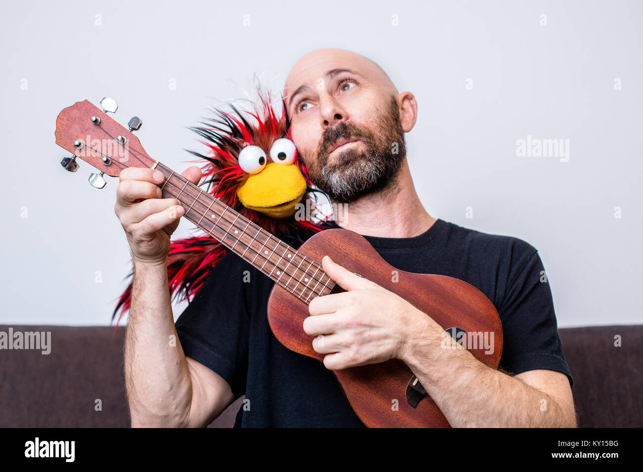 PORTRAIT OF SCHULTZ THE PUPPET AND BALD CAUCASIAN MAN WITH BEARD ...