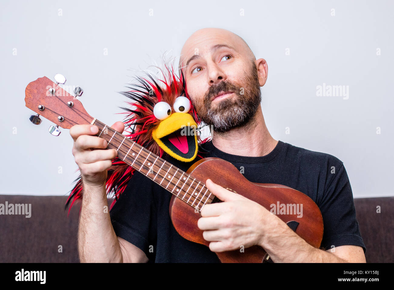 PORTRAIT OF SCHULTZ THE PUPPET AND BALD CAUCASIAN MAN WITH BEARD ...