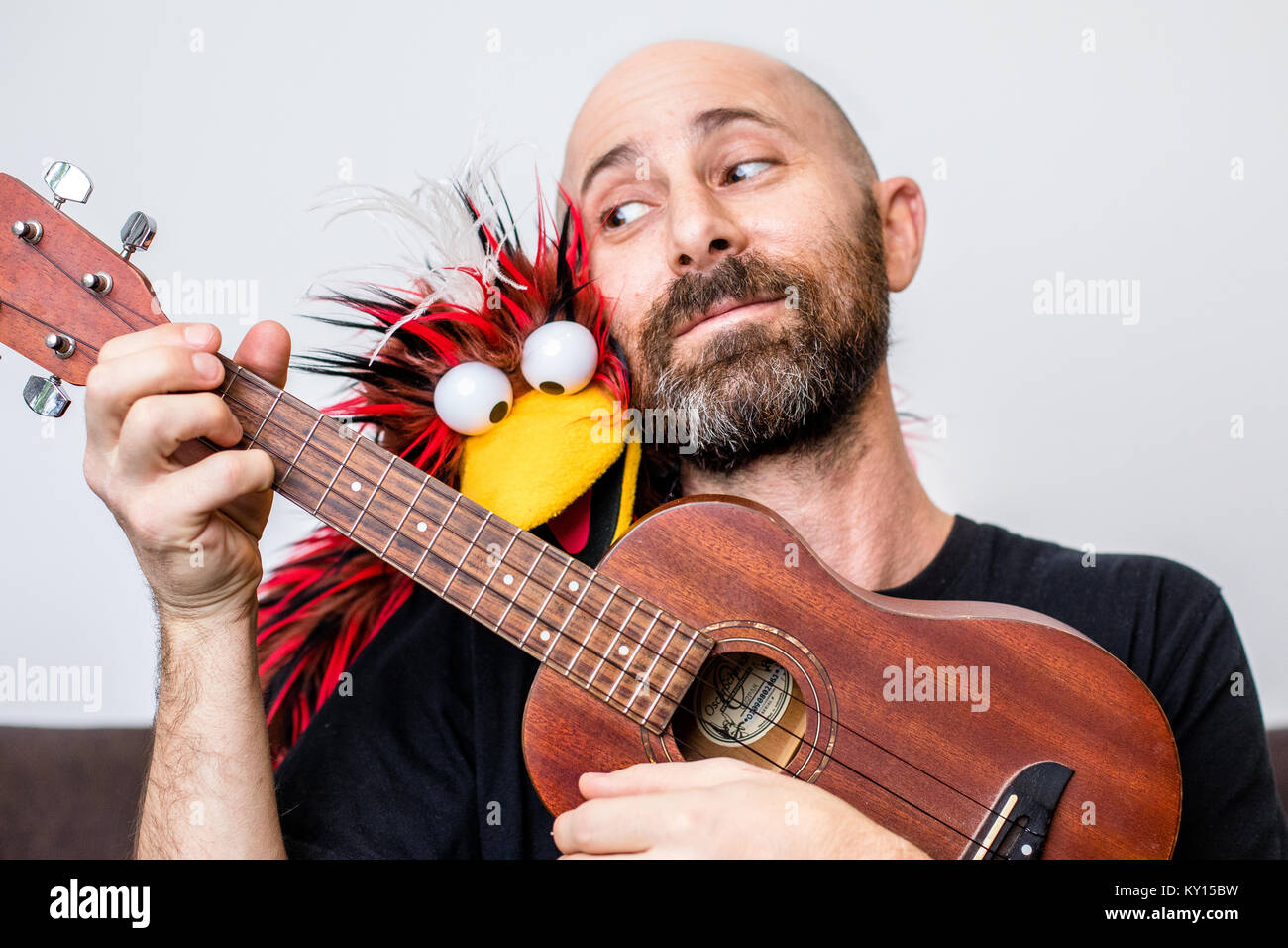 PORTRAIT OF SCHULTZ THE PUPPET AND BALD CAUCASIAN MAN WITH BEARD ...