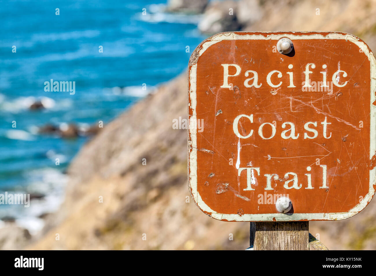 Sign for the Pacific Coast Trail overlooking the ocean in northern ...