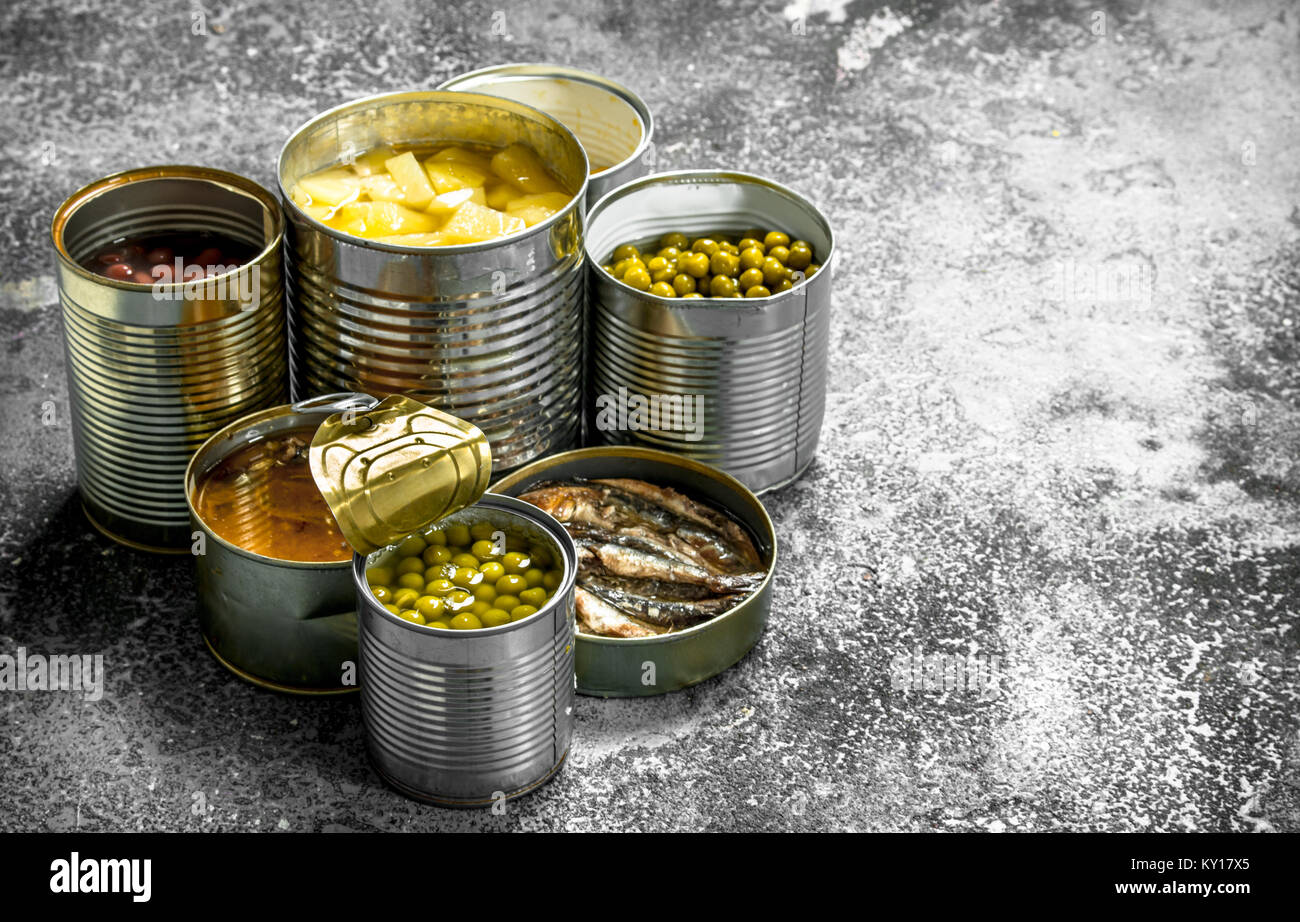 Various canned foods with meat, fish, vegetables and fruits in tin cans ...