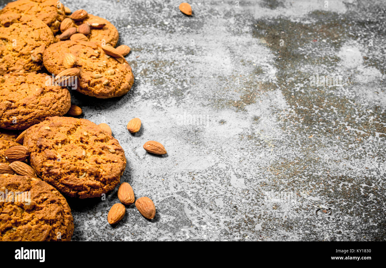 Oatmeal cookies with almonds. On a rustic background Stock Photo - Alamy