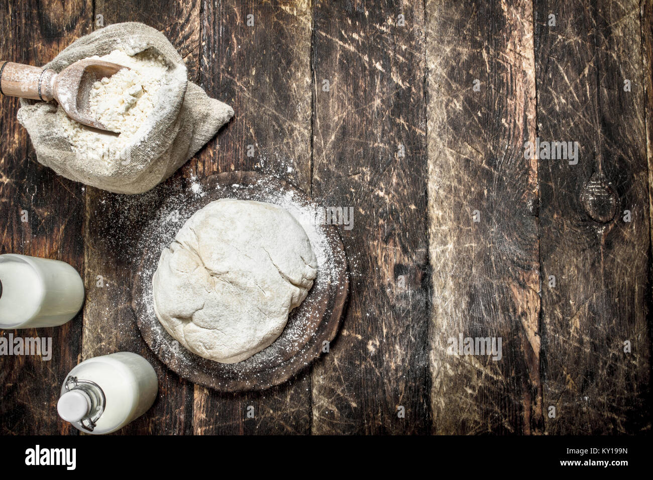 Dough made from fresh milk flour. On a wooden table Stock Photo - Alamy