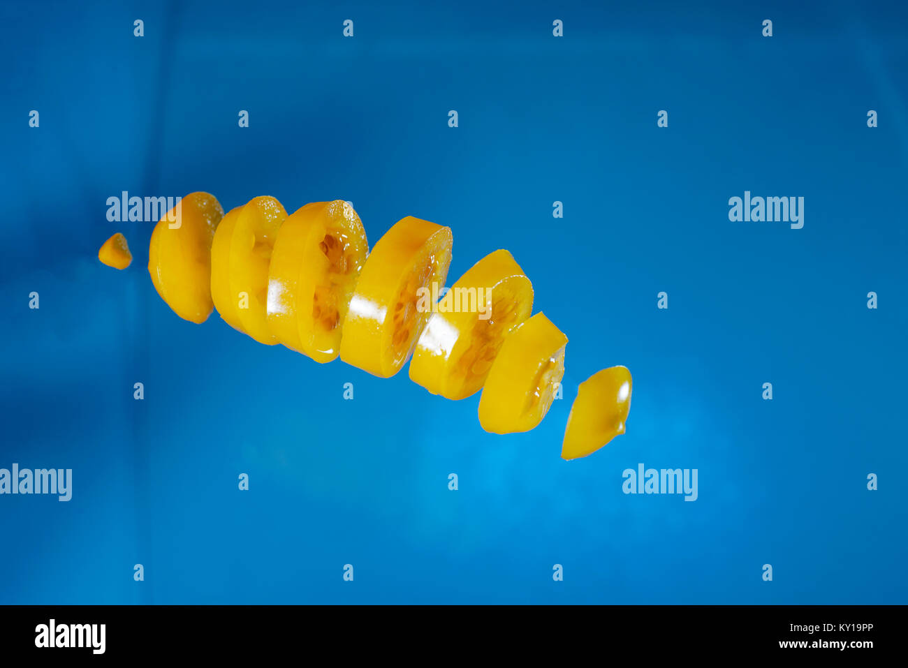 A tomato sliced and photographed in front of flash in the studio Stock ...