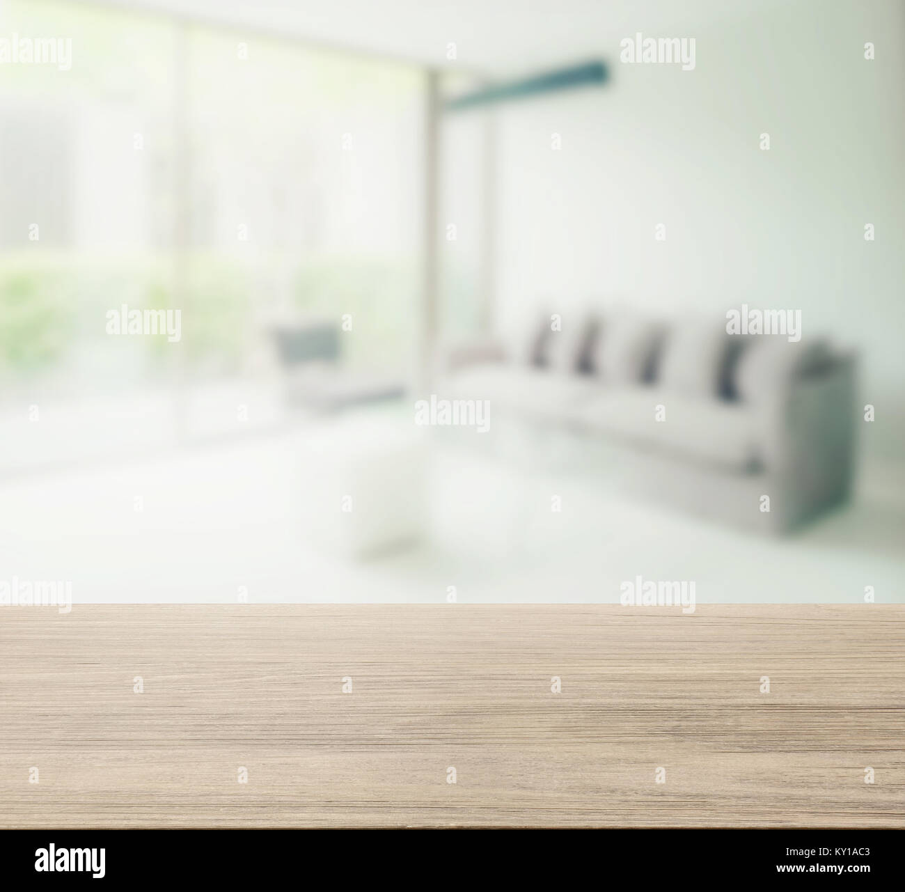 wooden table top with blur of modern living room interior Stock Photo ...