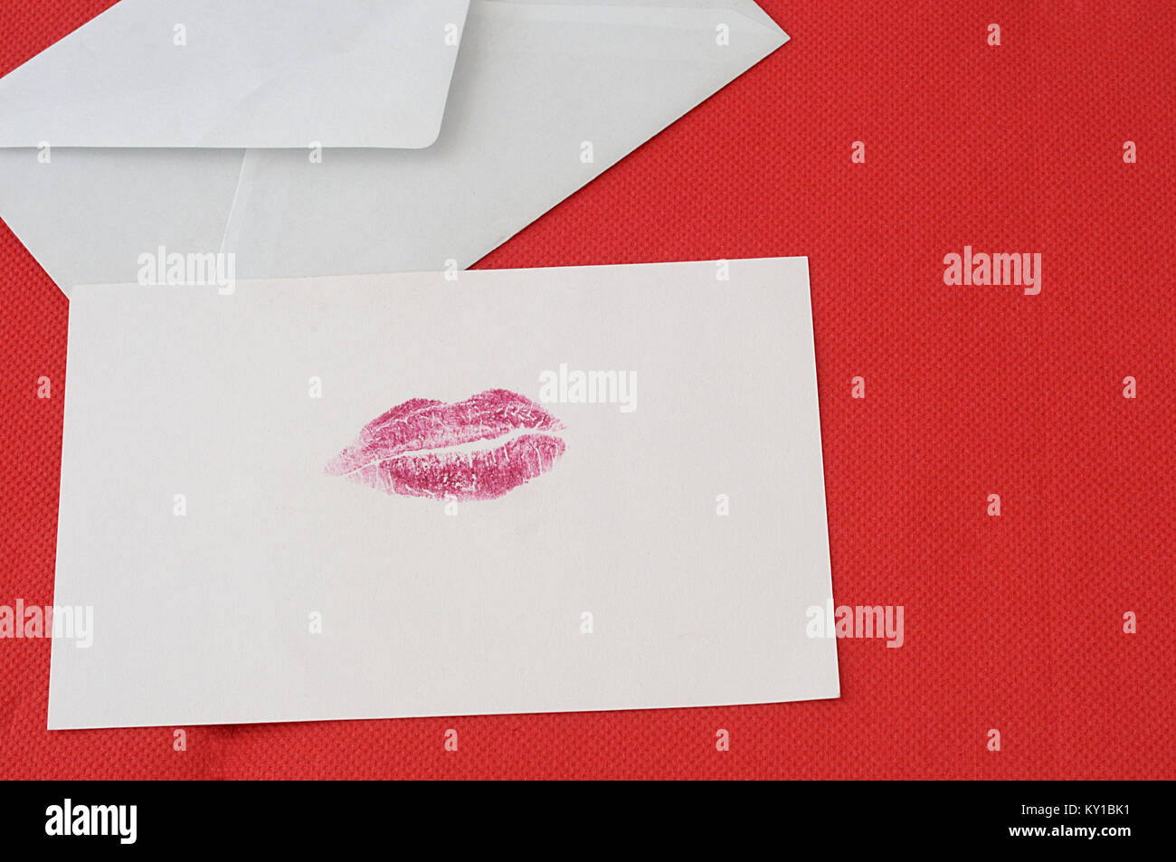 Red love background, letter with a red kiss Stock Photo - Alamy