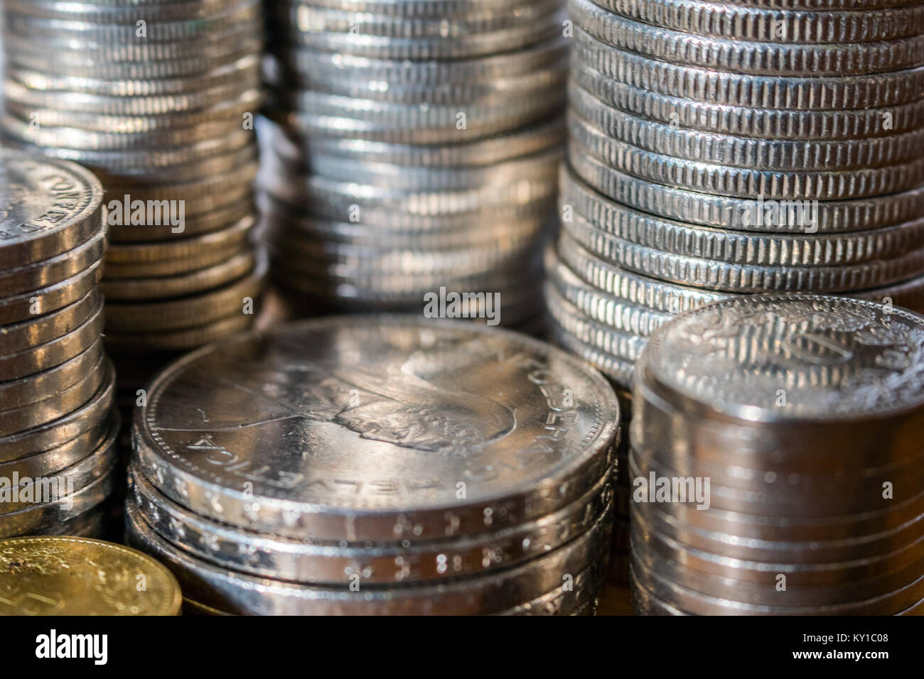 close up view of stacks of many Swiss franc coins in different ...