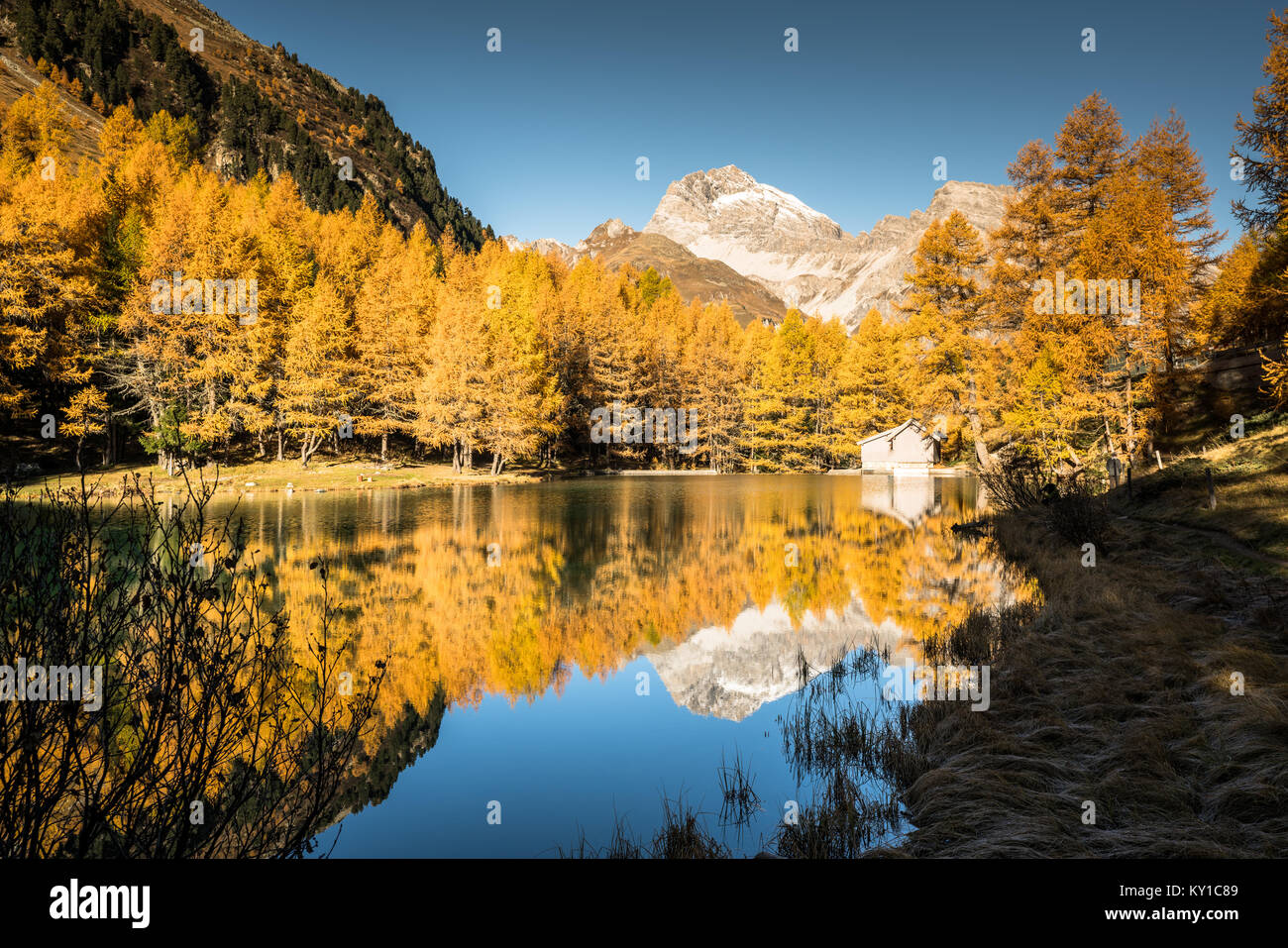gorgeous mountain lake in the Swiss Alps with fall colors and ...