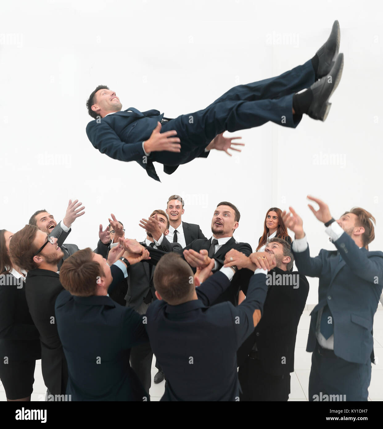 large business team rocking their leader Stock Photo - Alamy