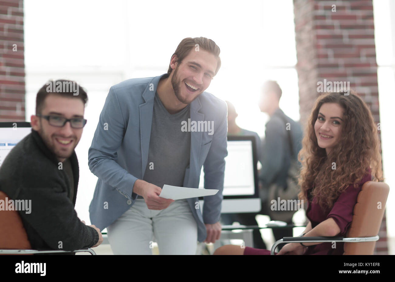 friendly business team talking in the office Stock Photo - Alamy