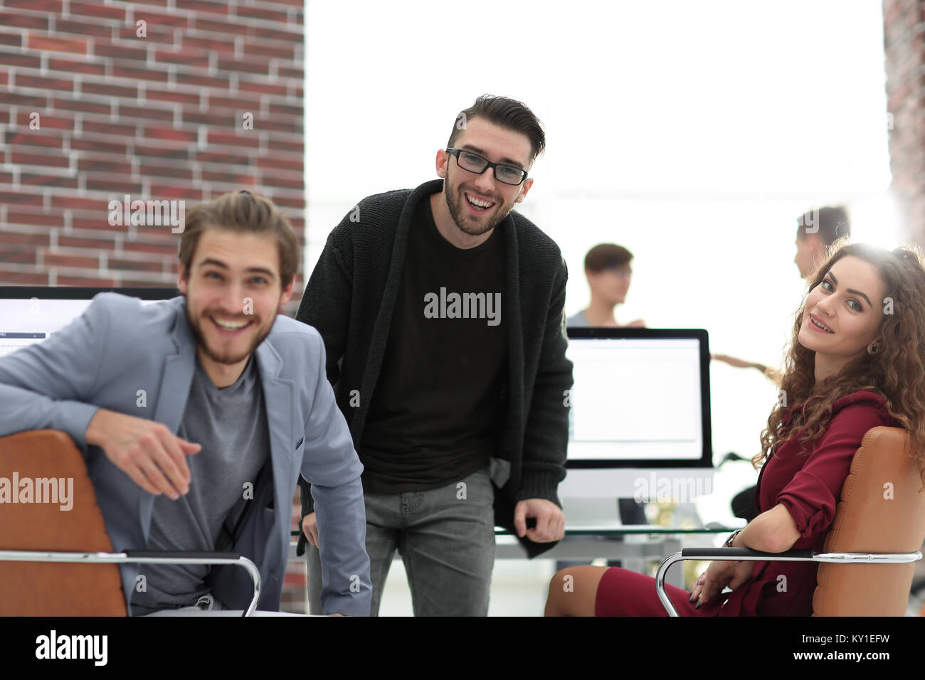 cheerful colleagues in the workplace Stock Photo - Alamy