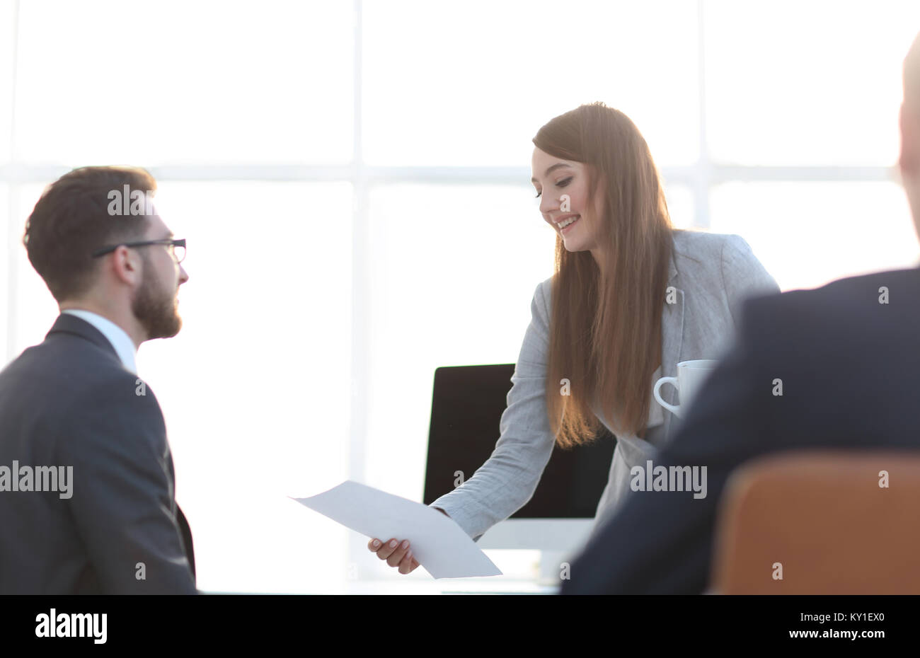 employee gives the Manager the document Stock Photo - Alamy