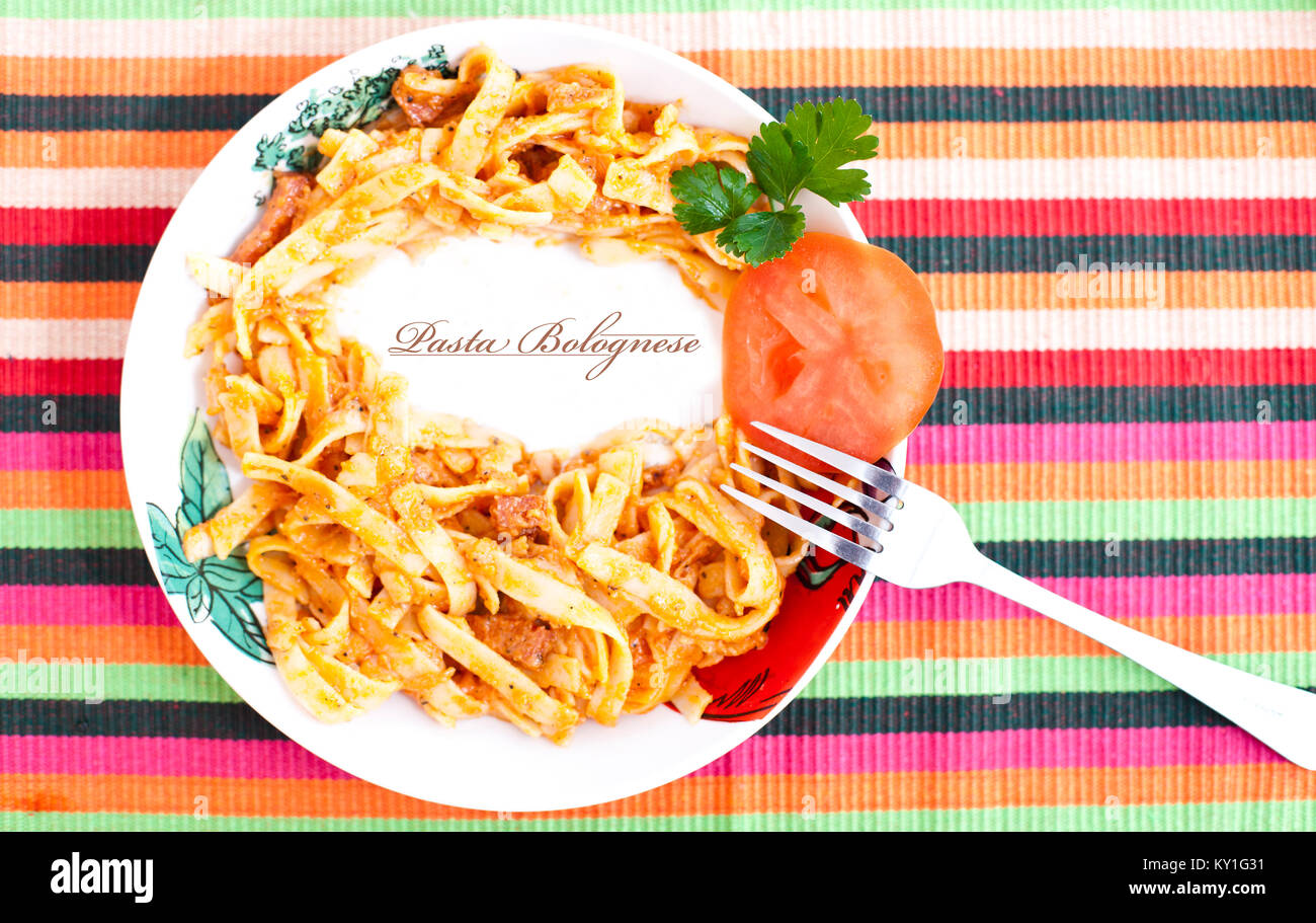 Bolognese pasta on colorful background, flat lay view, text added for ...