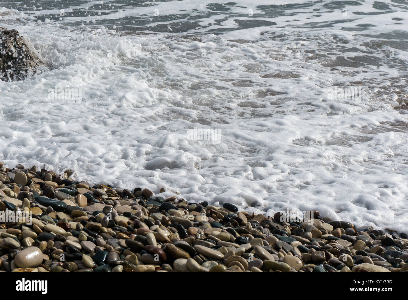 Photo of frothy sea, pebble Stock Photo - Alamy