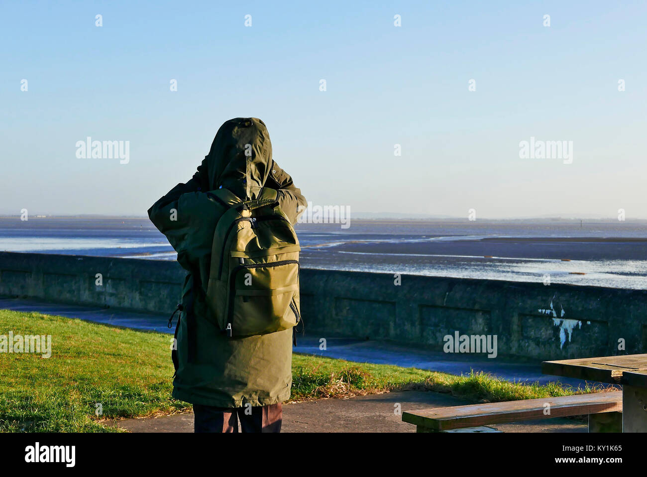 Bird watcher in camouflage green on the River Ribble estuary in ...