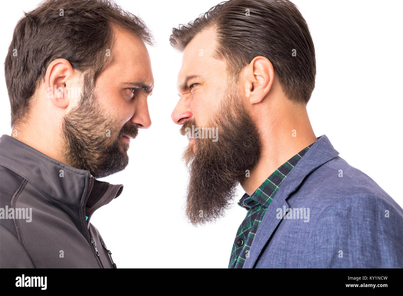 Two bearded angry men standing face to face isolated on white ...