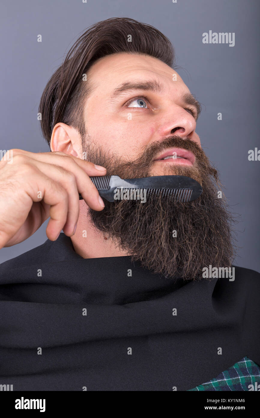 Combing beard hi-res stock photography and images - Alamy