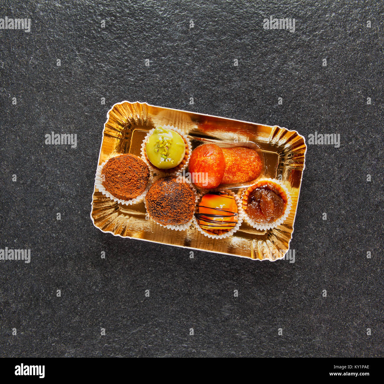 Italian Neapolitan sweets on a black stone background Stock Photo - Alamy