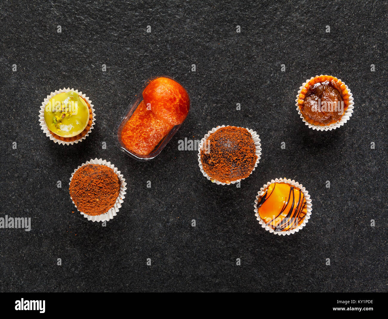 Italian Neapolitan sweets on a black stone background Stock Photo - Alamy