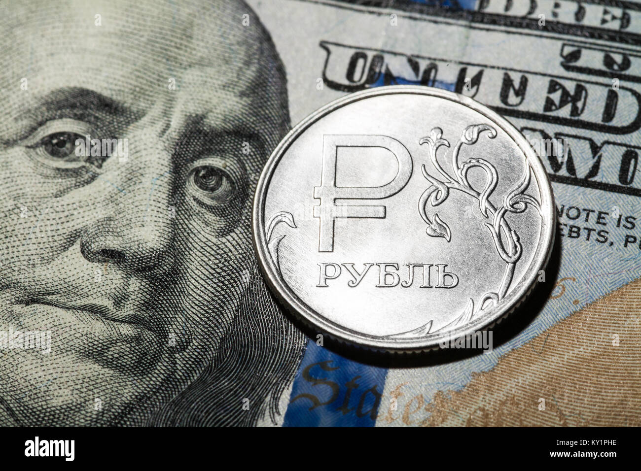 One ruble coin on dollar banknote Stock Photo - Alamy