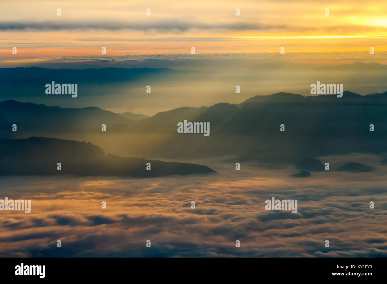 Mountain layer with cloud and sunbeam at dawn Stock Photo - Alamy