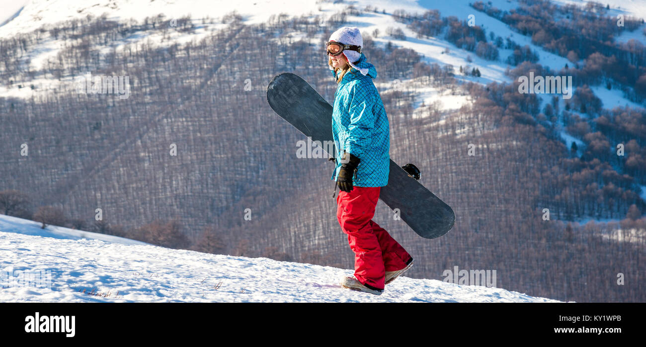 Young woman with snowboard Stock Photo - Alamy