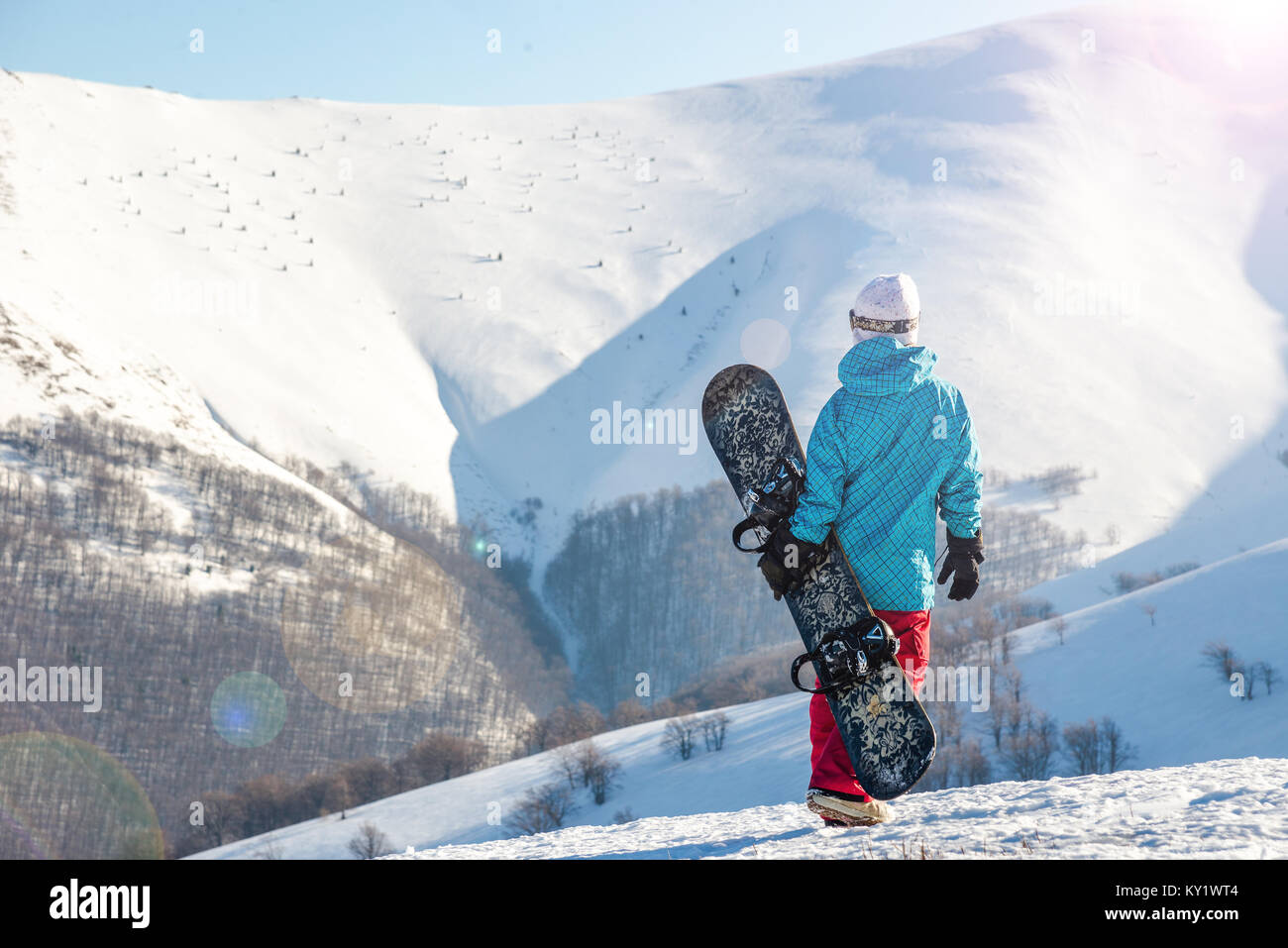 snowboarder girl standing with snowboard Stock Photo - Alamy