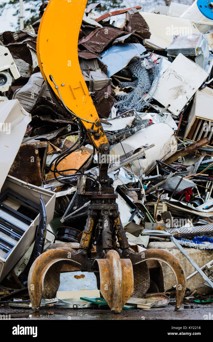 Powerful mechanical grabbing arm is the force that moves old scrap ...