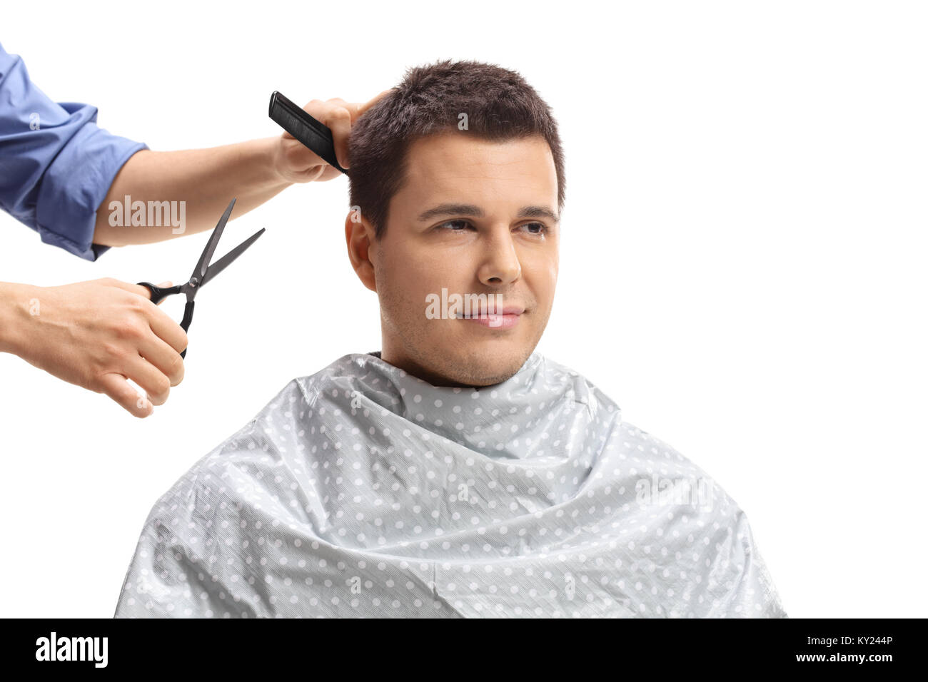 Young guy having a haircut isolated on white background Stock Photo - Alamy