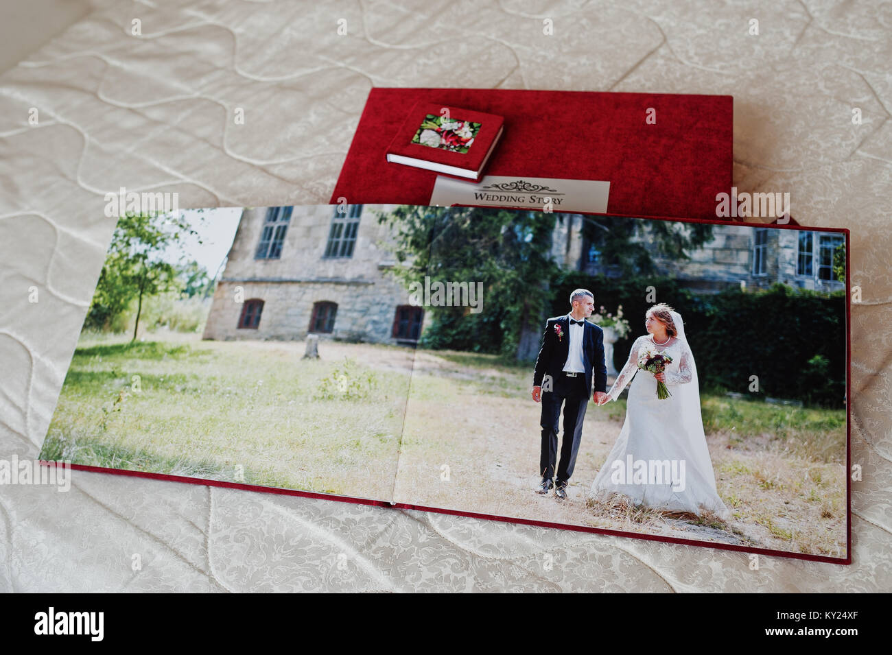 Pages of red wedding photobook or wedding album on white background ...