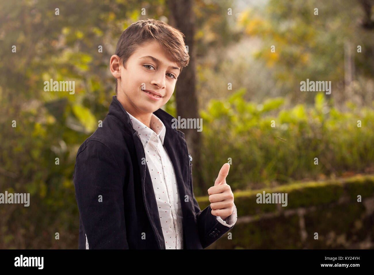 young boy show OK sign, outdoor with a nature background Stock Photo ...