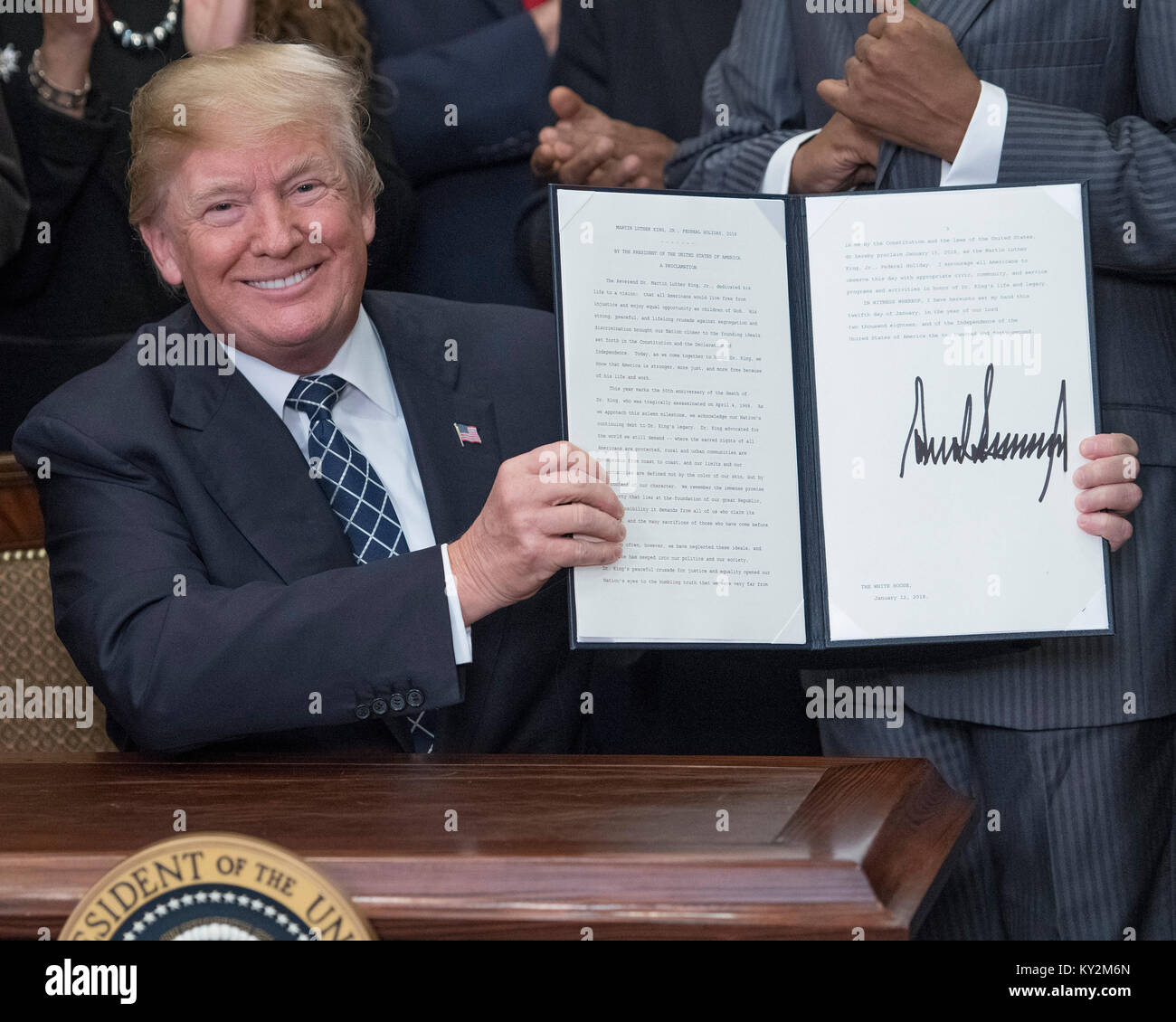 United States President Donald J. Trump signs a proclamation to honor ...