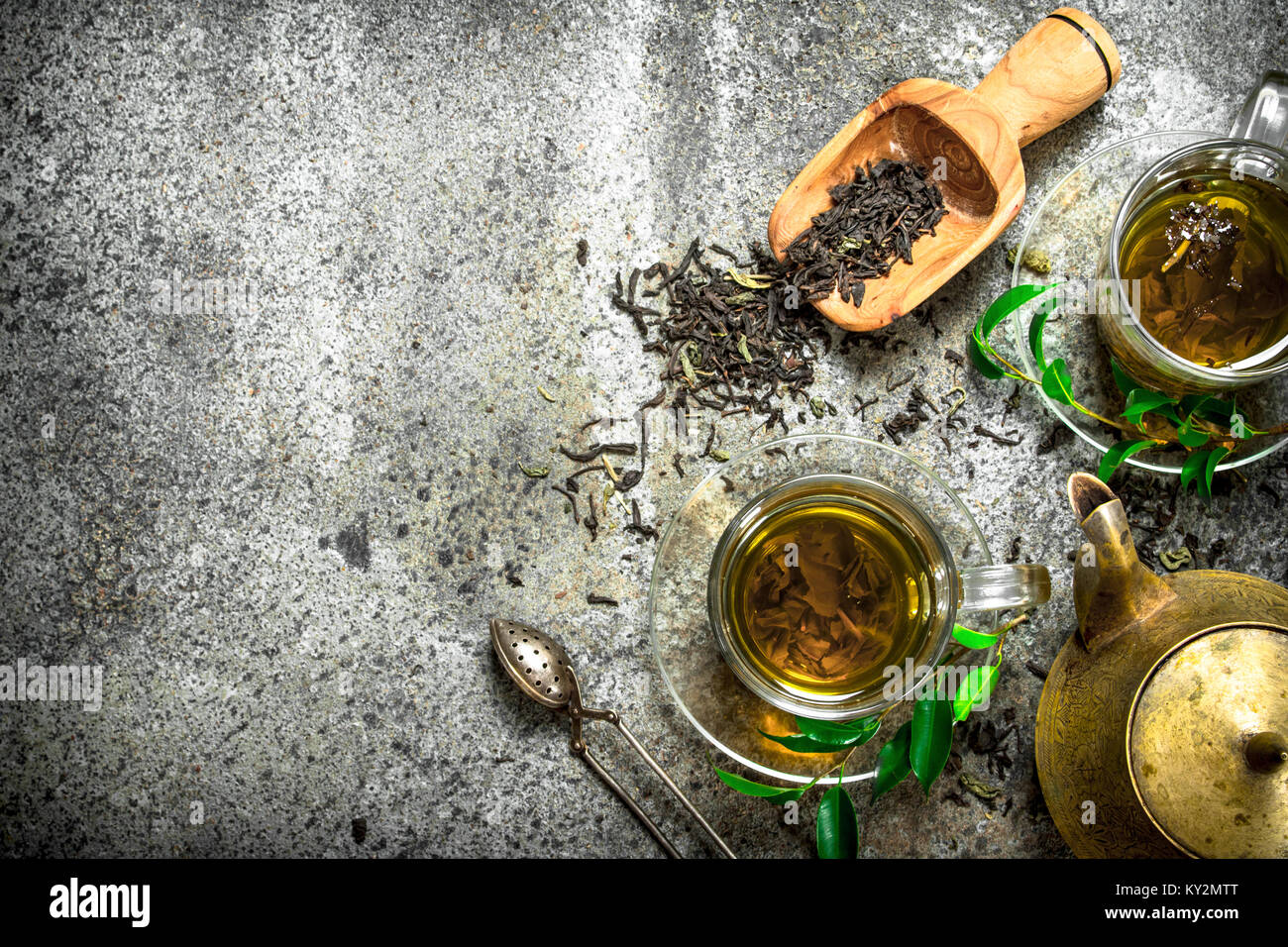 Fresh Indian tea with a brewer. On a rustic background Stock Photo - Alamy