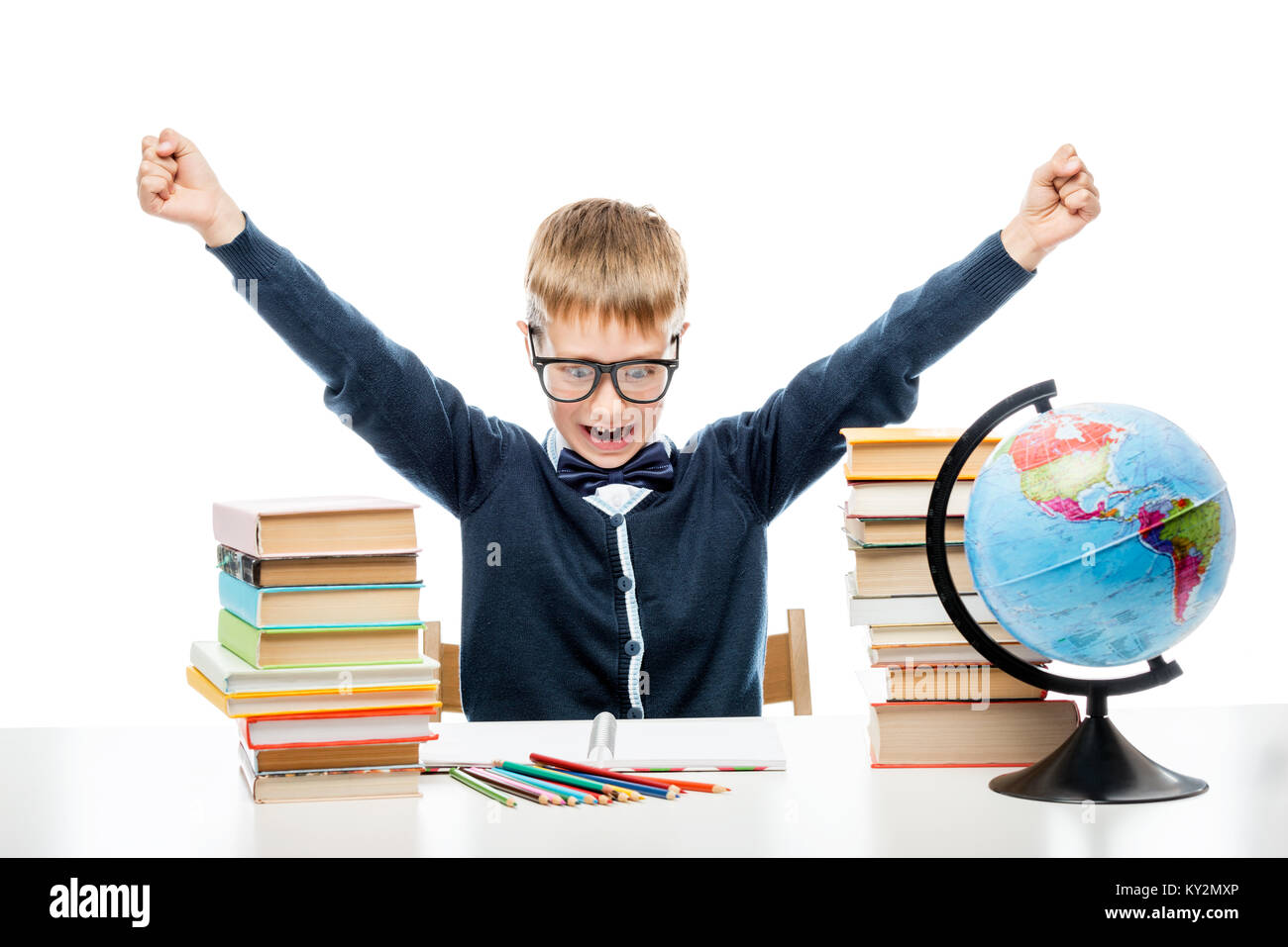angry boy at table with books and globe against white background Stock ...