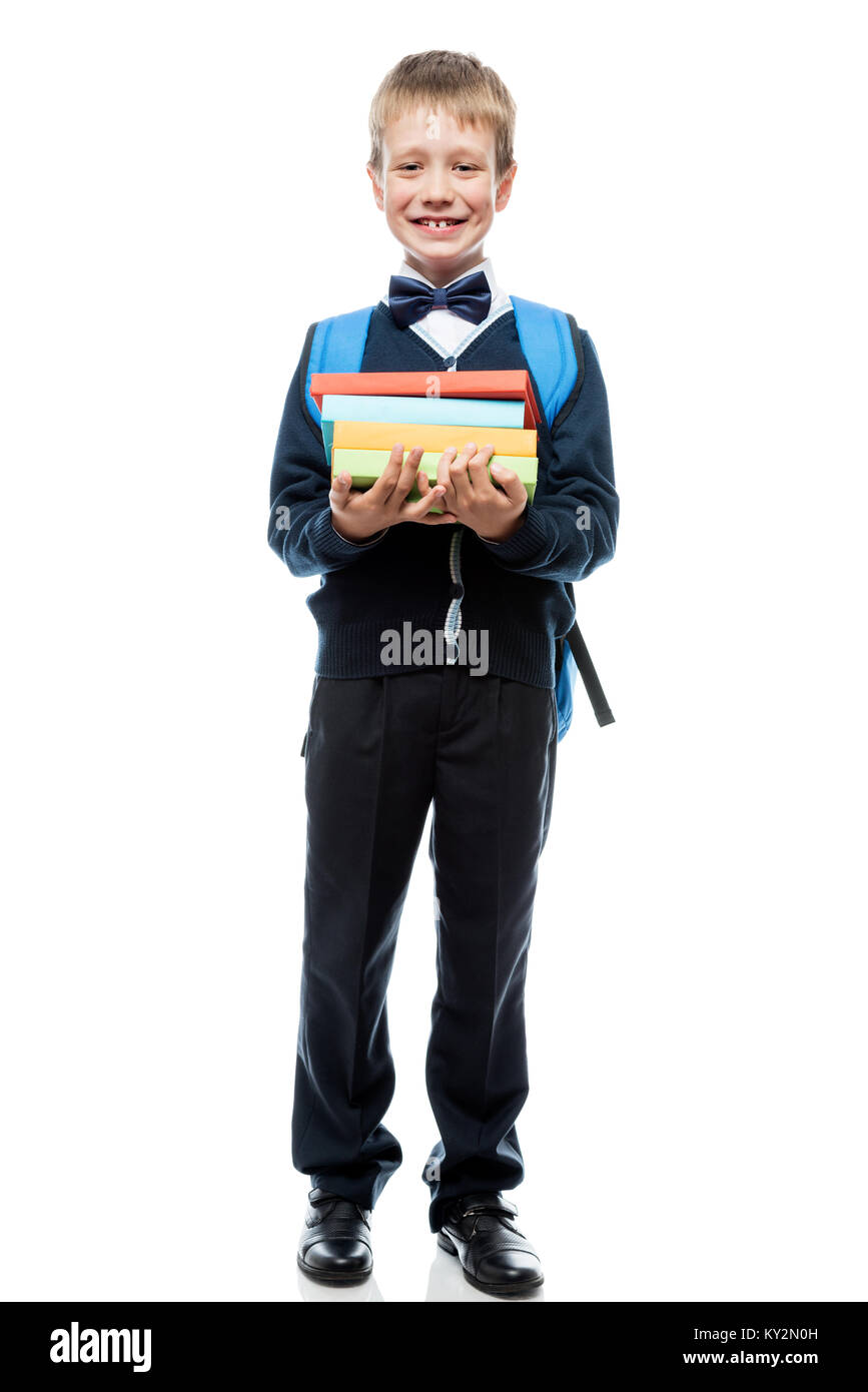 smiling schoolboy posing against white background, portrait is isolated ...