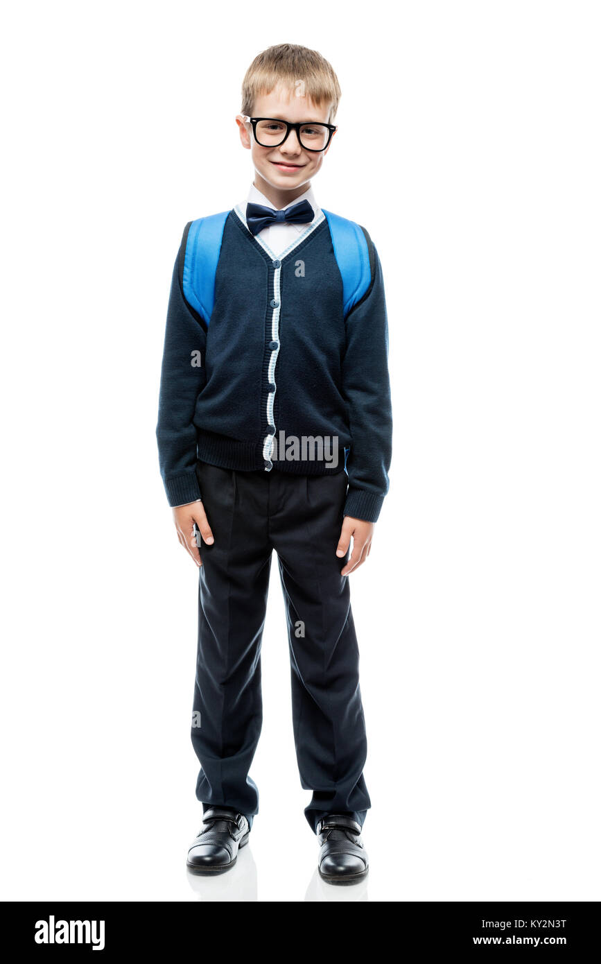 portrait of a smart schoolboy in high school uniform with a backpack in ...