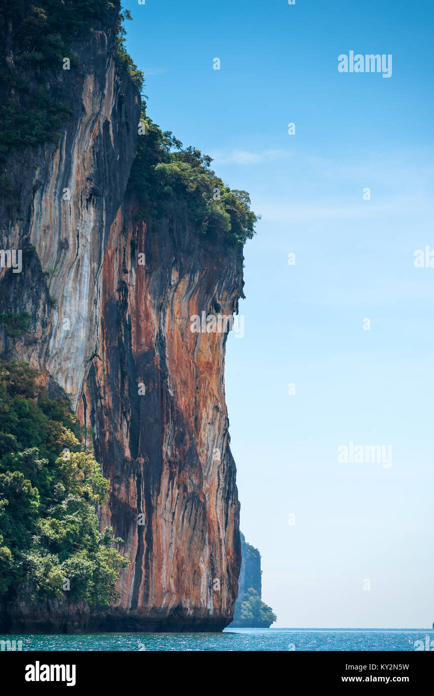 vertical landscape - view of a high steep cliff in the sea in Krabi ...