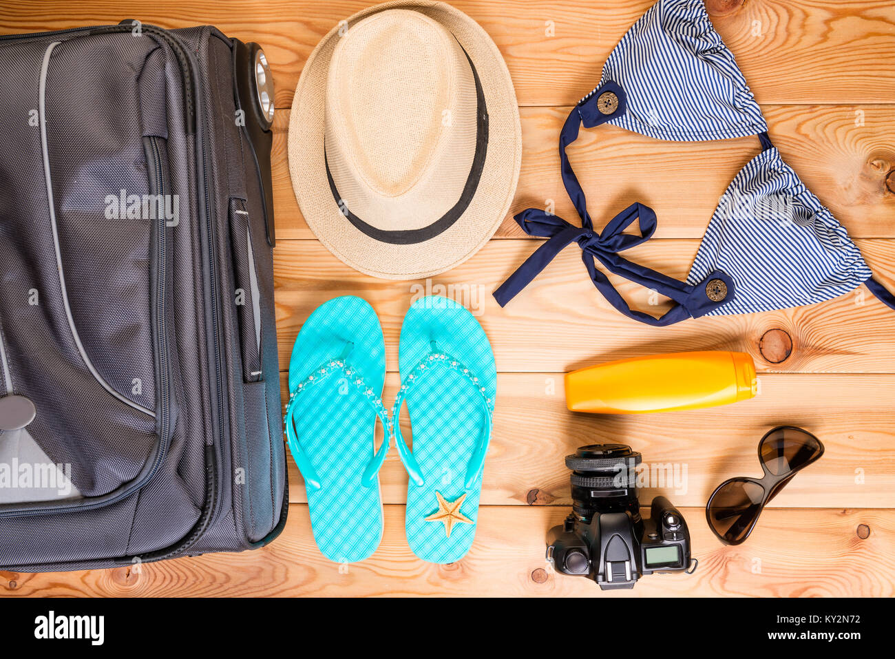 suitcase and ready objects for a woman to relax on the beach Stock ...