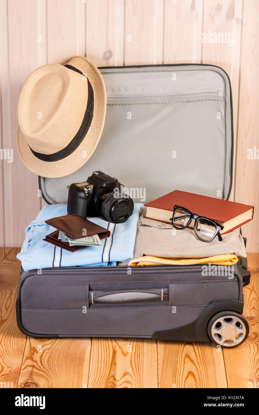 open suitcase with a broadcaster ready for a big trip Stock Photo - Alamy