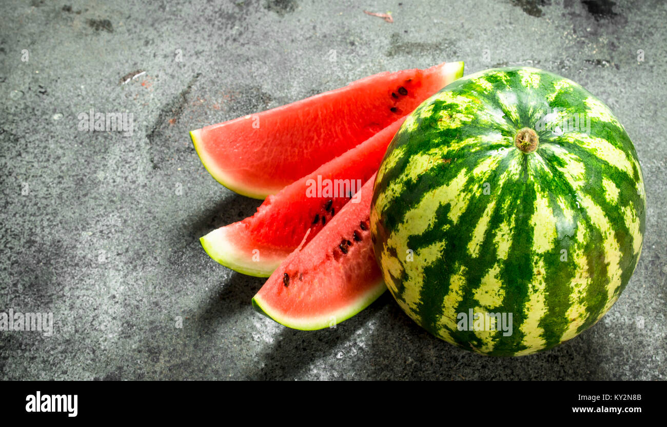 Fresh ripe watermelon. On a rustic background Stock Photo - Alamy