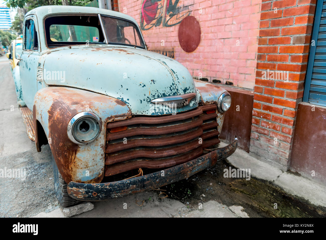 old rusty retro car on the street near the building Stock Photo - Alamy