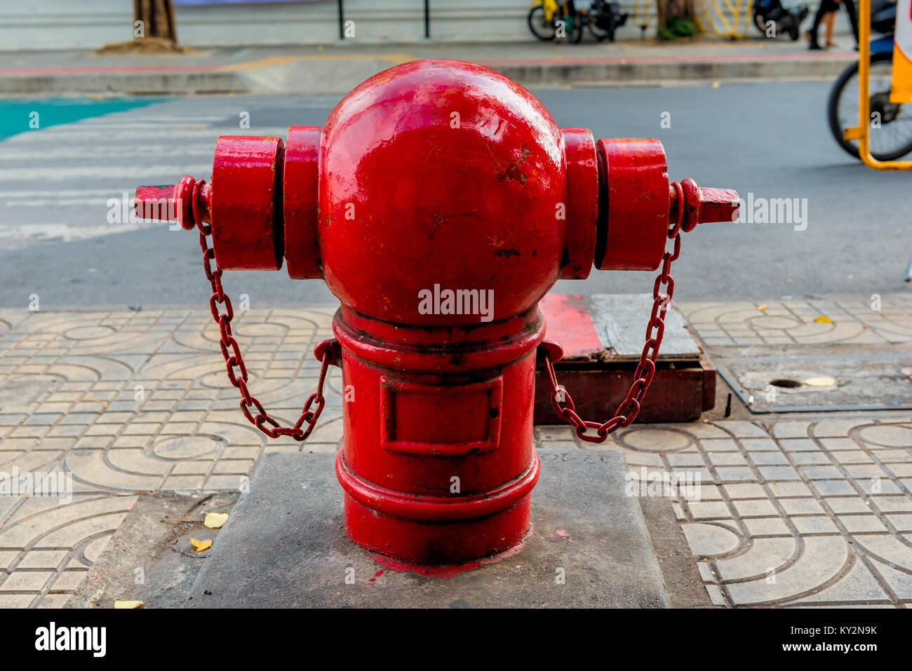 bright red fire hydrant in Bangkok street close-up Stock Photo - Alamy