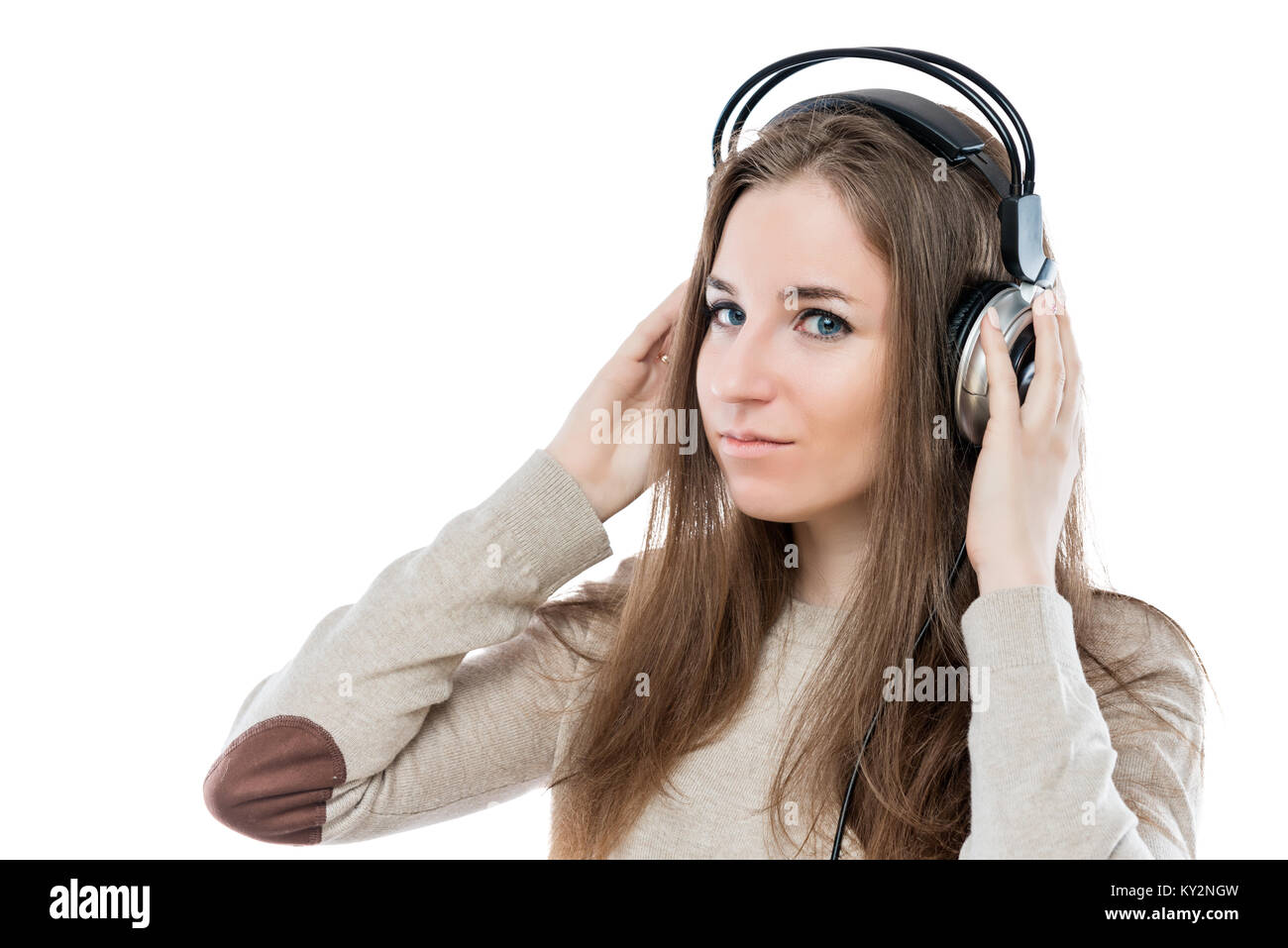 beautiful young girl with headphones posing on white background in ...