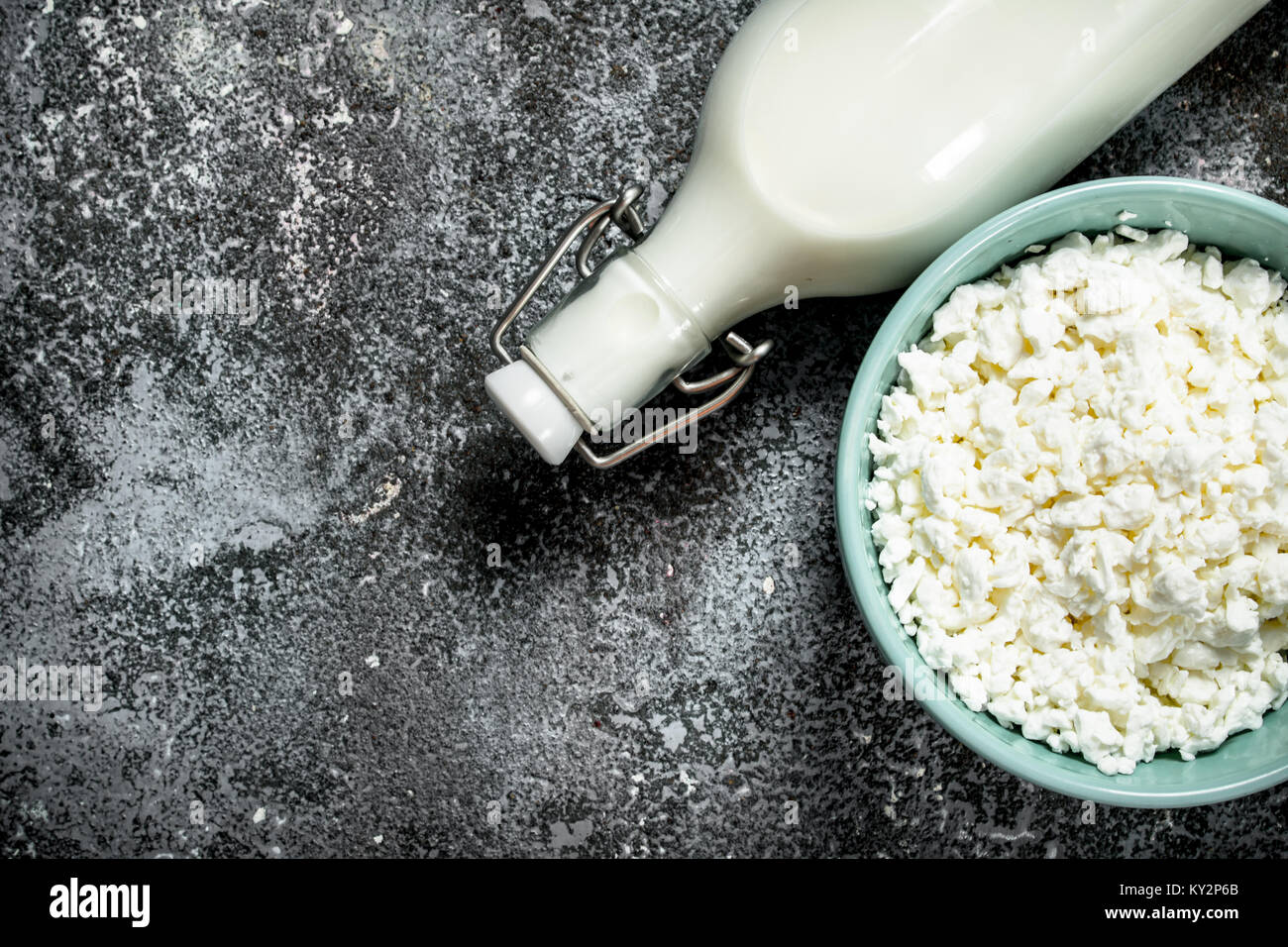 Cottage cheese and natural cow milk. On a rustic background Stock Photo ...