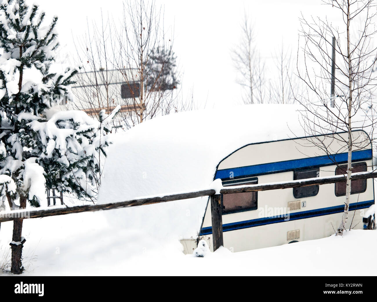 campside with several rv in bulgarian winter forest Stock Photo - Alamy