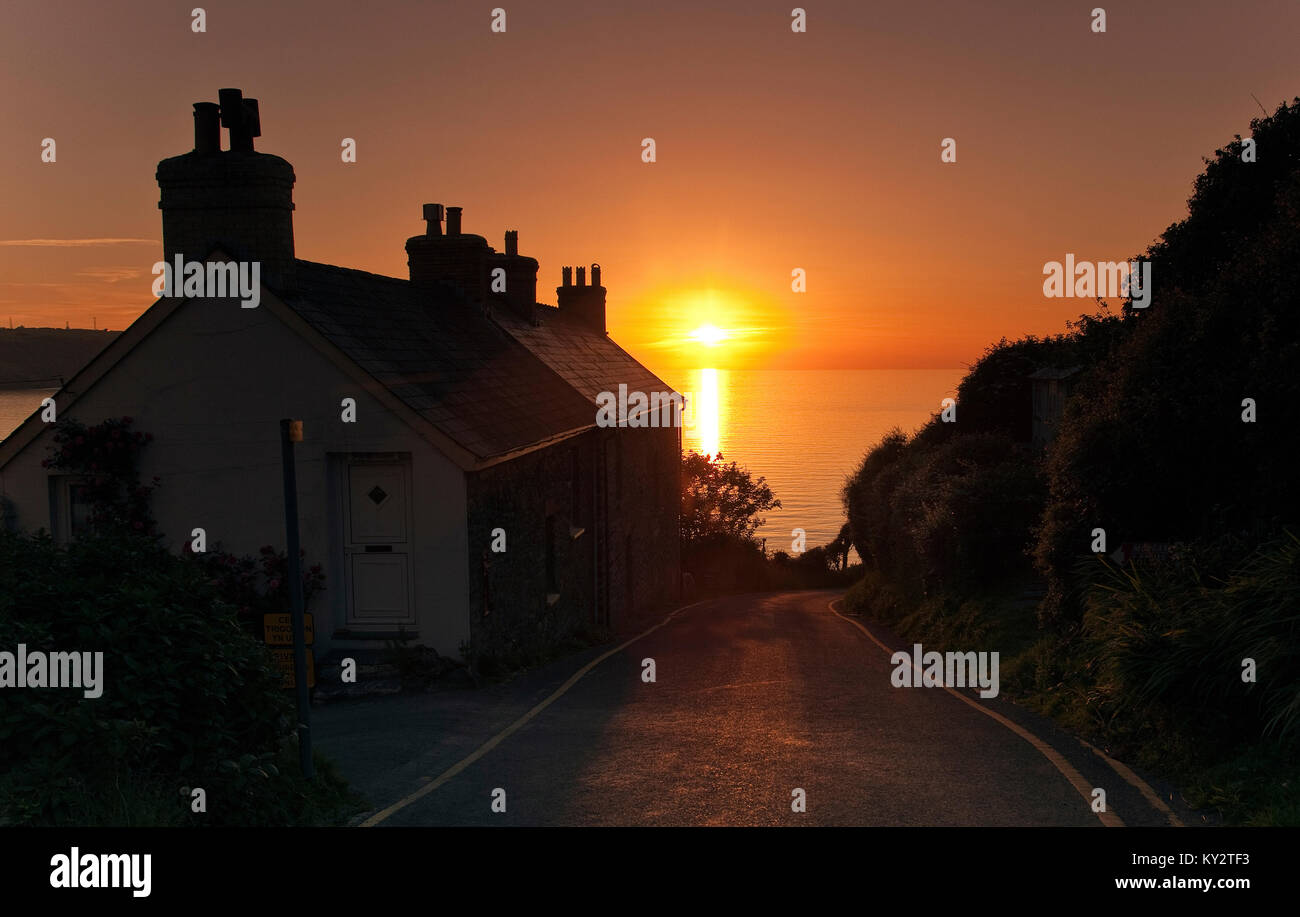 Photograph of House in silhouette summer sunset on the Irish Sea at ...