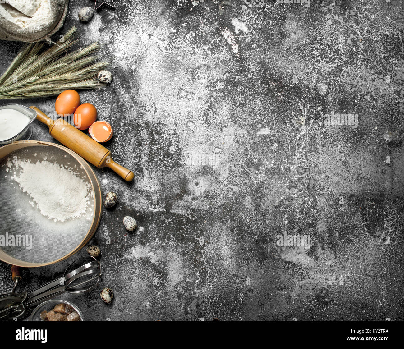 Baking background. Ingredients and tools for dough preparation. On a ...