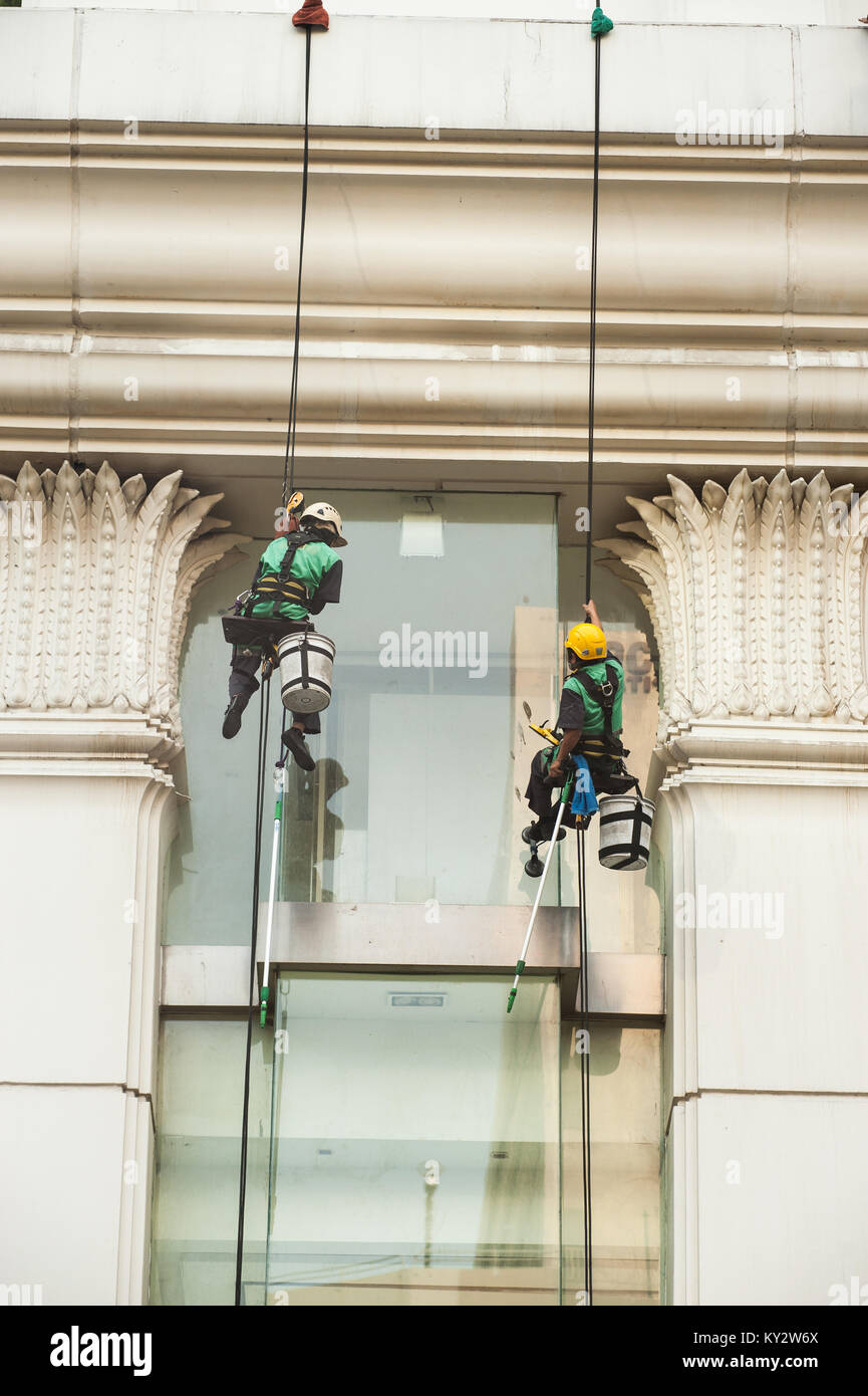 BANGKOK, THAILAND-NOVEMBER 18,2016 :Group of unidentified Glass cleaner ...
